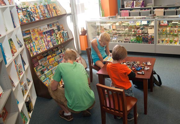 illustrated men: local comic book stores embrace city's superhero heritage