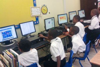 university of phoenix donates computers to local school